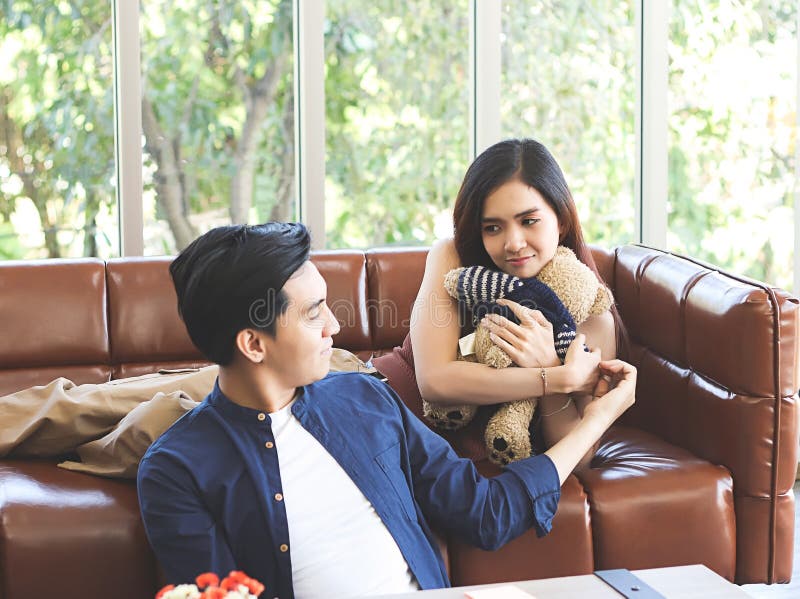Attractive Asian Couple Spend Time Together A Woman Sitting On Couch