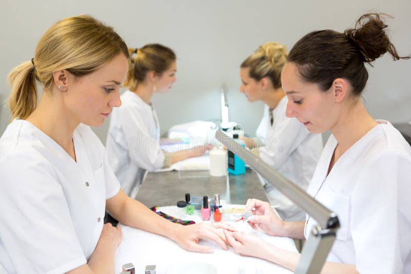 Two Young Beautician Students Working during Make Up Classes Stock ...