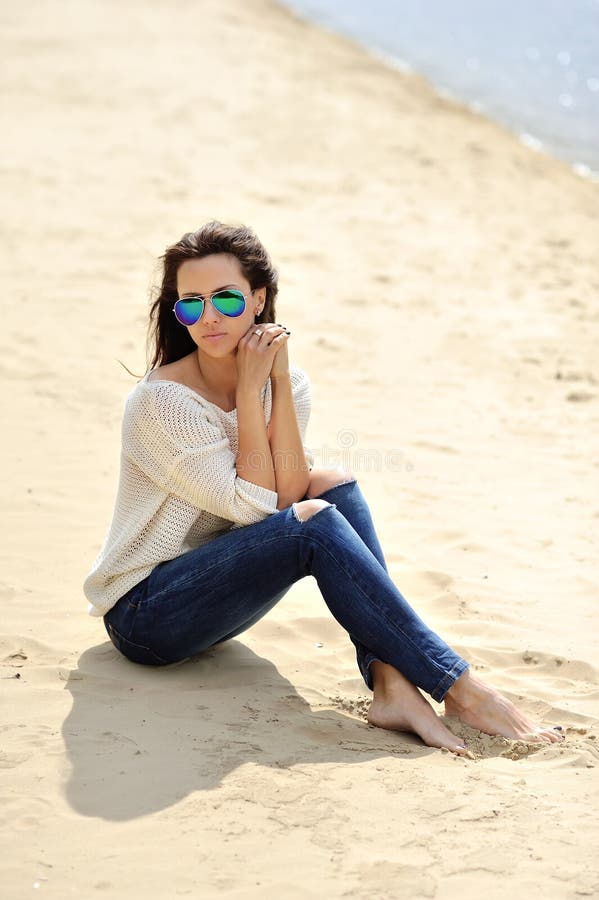 Young Attractive Cheerful Woman Sitting on a Sand Stock Image - Image ...