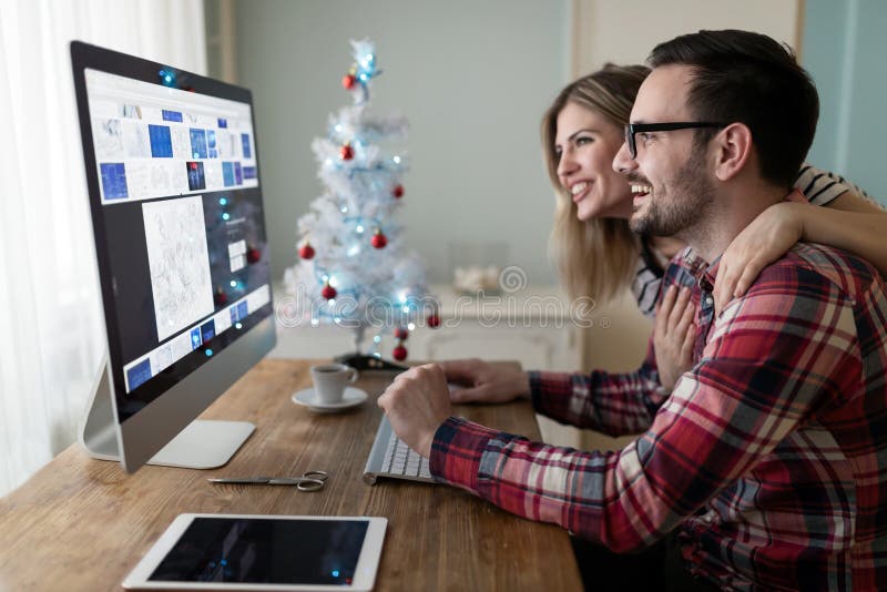 Young Couple of Designers Working on Computer Stock Photo - Image of ...