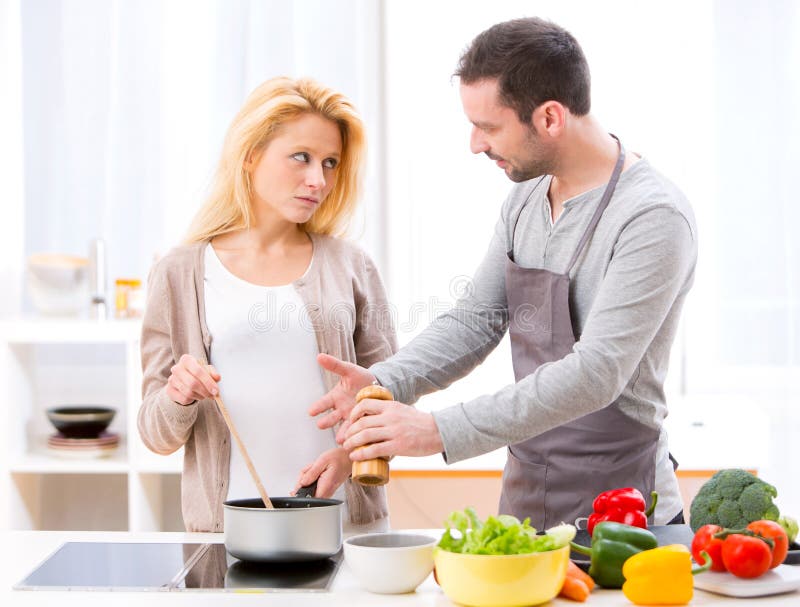Young Attractive Couple Having an Argue while Cooking Stock Photo ...