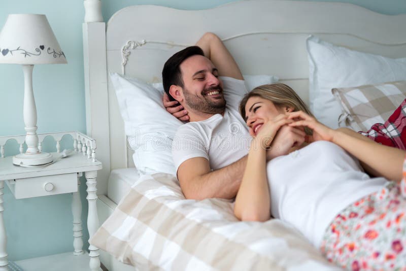 Young Attractive Couple Having Romantic Time in Bed Stock Photo - Image ...