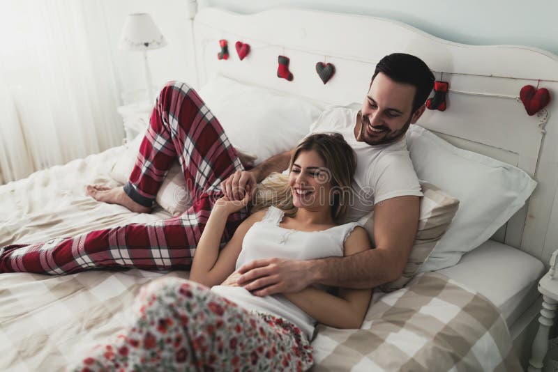 Young Attractive Couple Having Romantic Time in Bed Stock Photo - Image ...