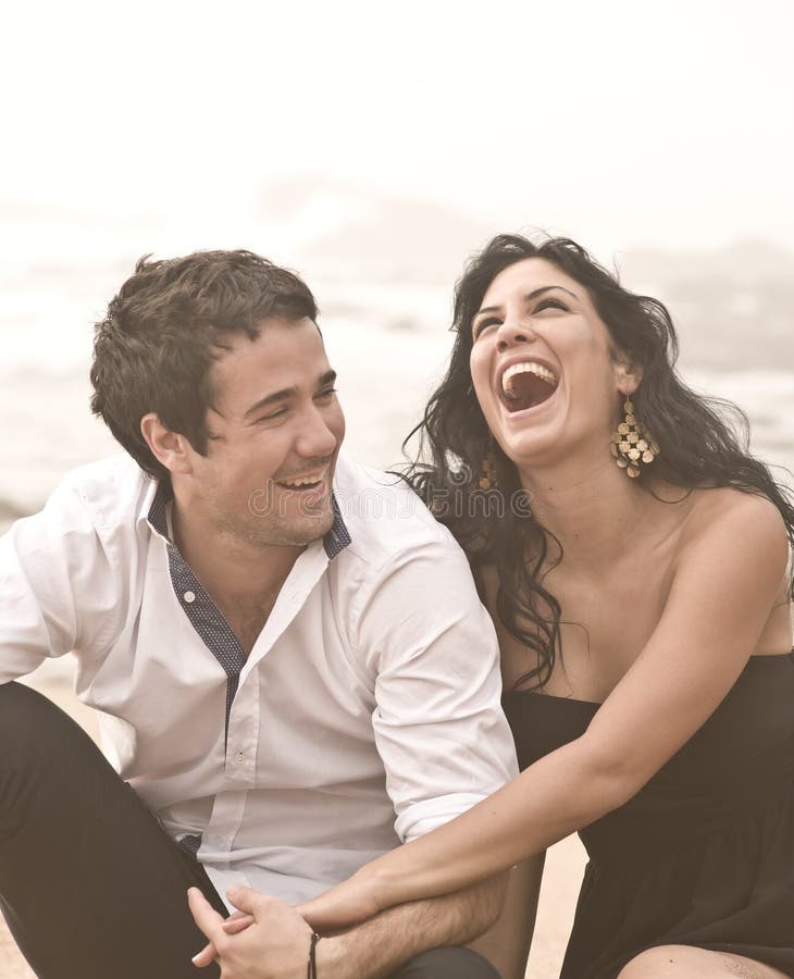 Young Attractive Couple Laughing on Beach Stock Image - Image of adult ...