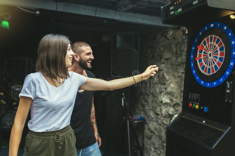 Young Attractive Couple Playing Darts Stock Photo - Image of casual ...