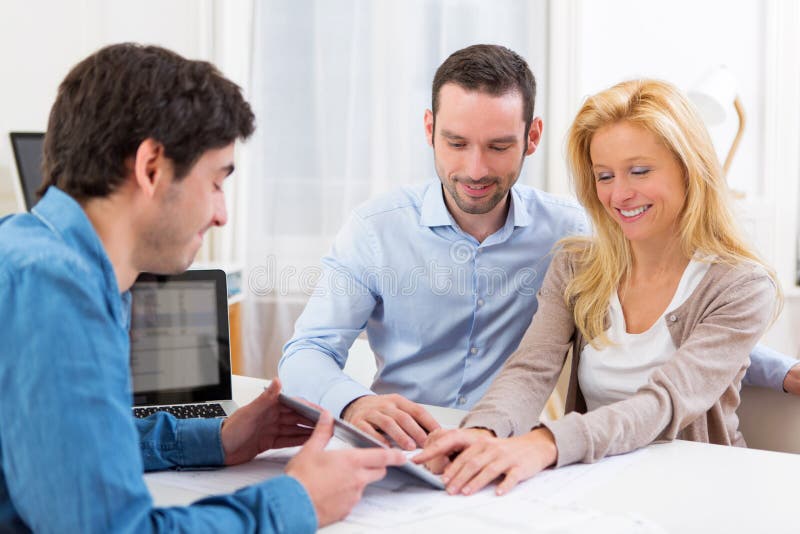 Young Attractive Couple Signing Contract on Tablet Stock Photo - Image ...