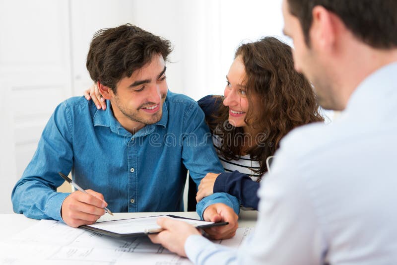 Young Attractive Couple Signing Contract Stock Image - Image of ...