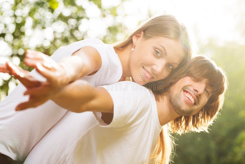 Smiling Young Couple Having Fun at the Beach Stock Image - Image of ...
