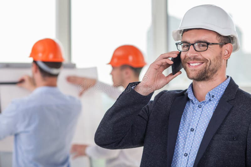 Young Attractive Engineer is Communicating with Stock Photo - Image of ...