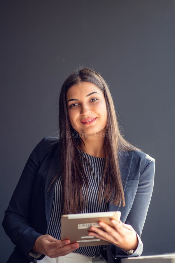 Young Attractive Female Manager Working on Digital Tablet while ...