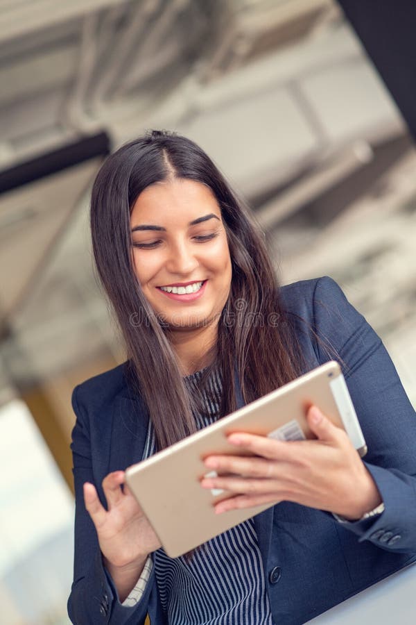 Young Attractive Female Manager Working on Digital Tablet while ...