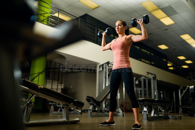 Young Attractive Female Working Out in a Gym Stock Photo - Image of ...