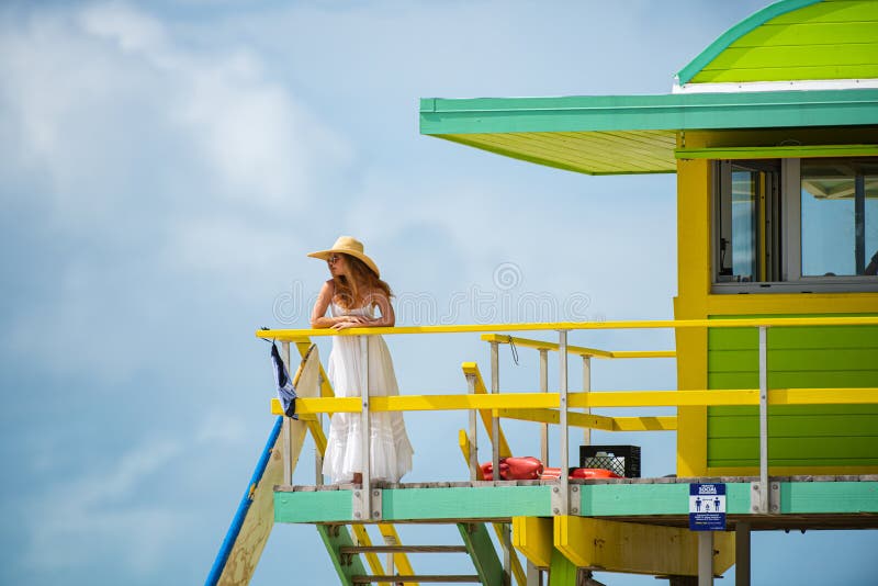 Beautiful Girl With Straw Hat Enjoying Sunbath At South Beach Miami