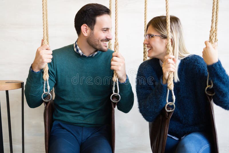 Young Attractive Couple on Date Relaxing in Swing Stock Image - Image ...