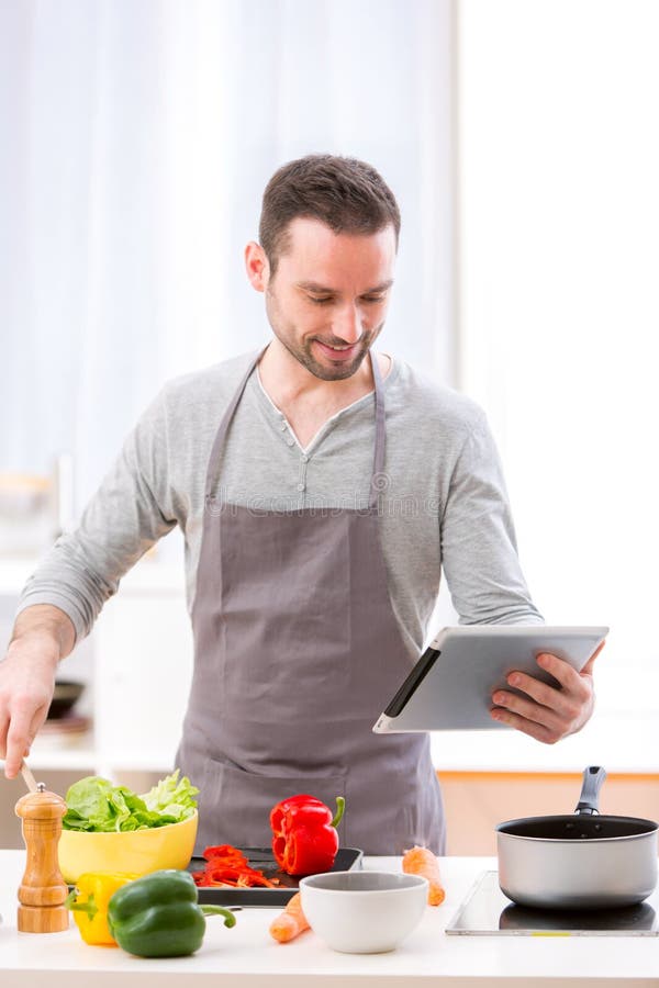 Young Attractive Man Cooking in a Kitchen Stock Image - Image of food ...