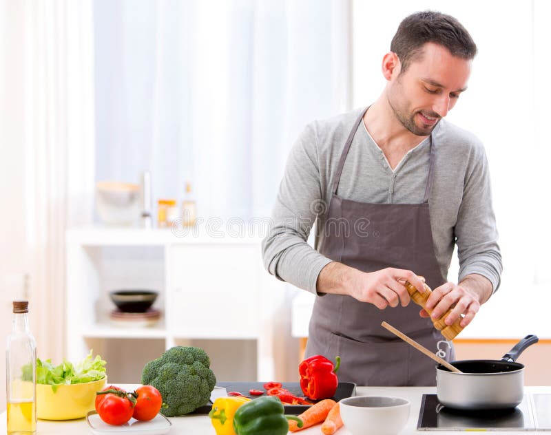 Young Attractive Man Cooking in a Kitchen Stock Photo - Image of happy ...