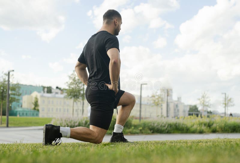 Young Attractive Man Doing Lunge Outdoor in the Park. Stock Image ...