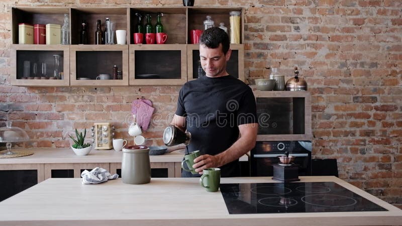 Young Attractive Man Making Coffee in the Kitchen for Breakfast Stock ...