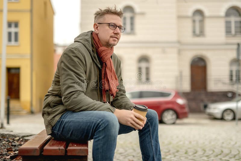 Young Attractive Man Sitting on Bench in Park Stock Image - Image of ...