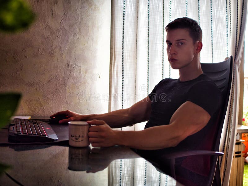 Young Attractive Man Sitting at Computer Desk Working Stock Image ...