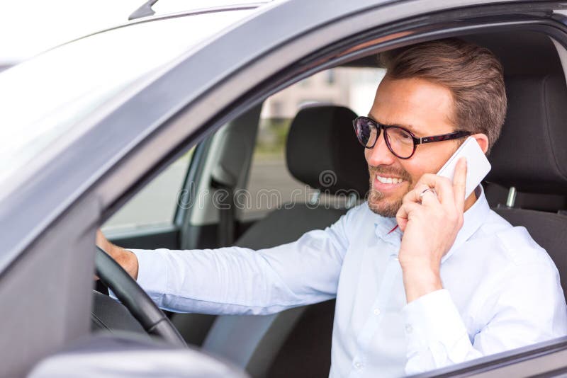 Young Attractive Man Using Mobile Phone in His Car Stock Image - Image ...