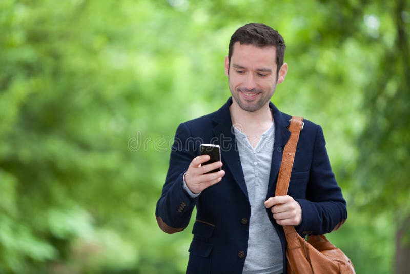 Young Man with Smartphone on Sunny Street Stock Image - Image of road ...