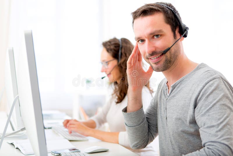 Young Attractive Man Working in a Call Center Stock Photo - Image of ...