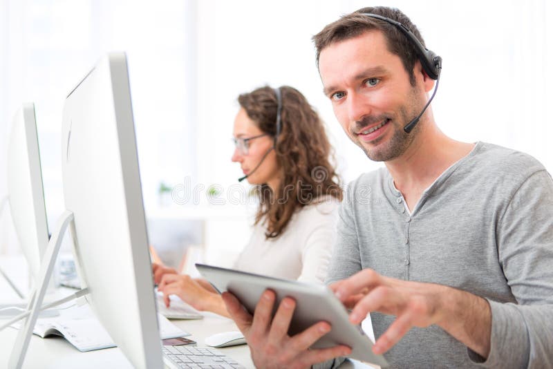 Young Attractive Man Working in a Call Center Stock Image - Image of ...