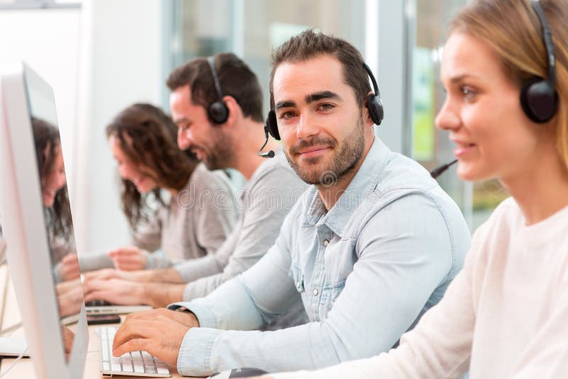 Young Attractive Man Working in a Call Center Stock Photo - Image of ...