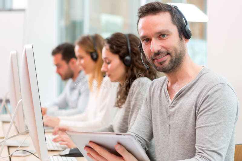 Young Attractive Man Working in a Call Center Stock Photo - Image of ...
