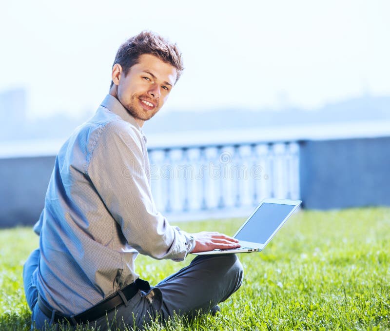 Young Attractive Man Working on Laptop Outdoor Stock Image - Image of ...