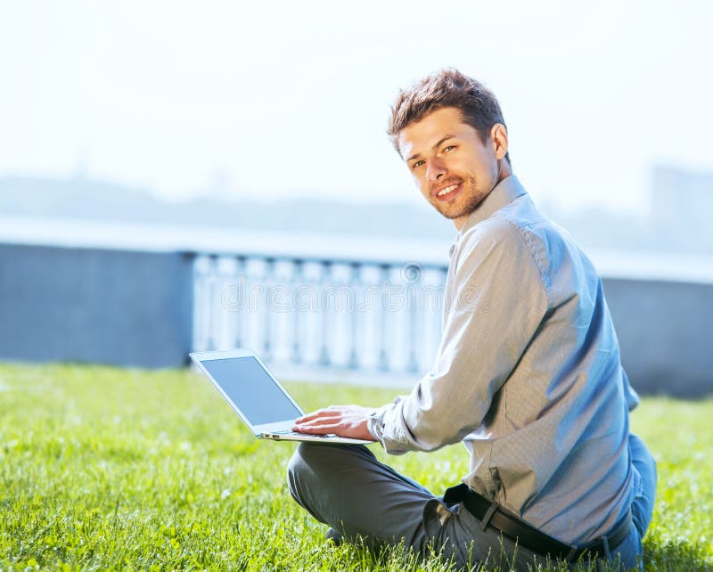 Young Attractive Man Working on Laptop Outdoor Stock Image - Image of ...