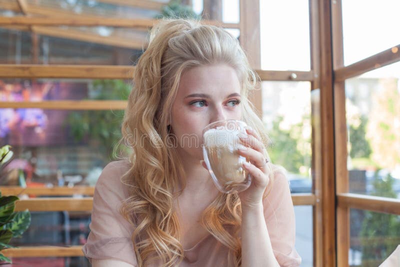 Young Attractive Model Woman with Cup of Coffee Sitting in Cafe Stock ...