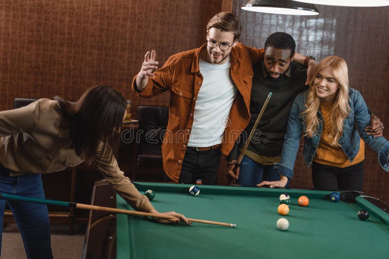 Young Attractive Multiethnic Friends Playing in Pool Stock Photo ...
