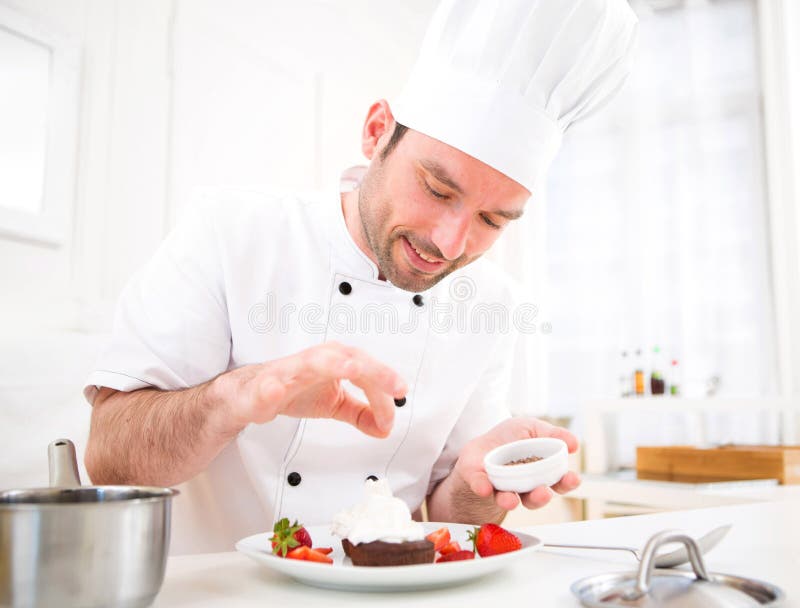 Young Attractive Professional Chef Cooking in His Kitchen Stock Photo ...