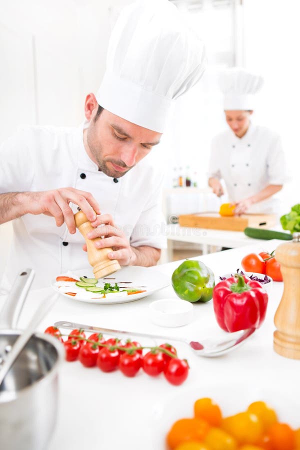 Young Attractive Professional Chef Cooking in His Kitchen Stock Image ...