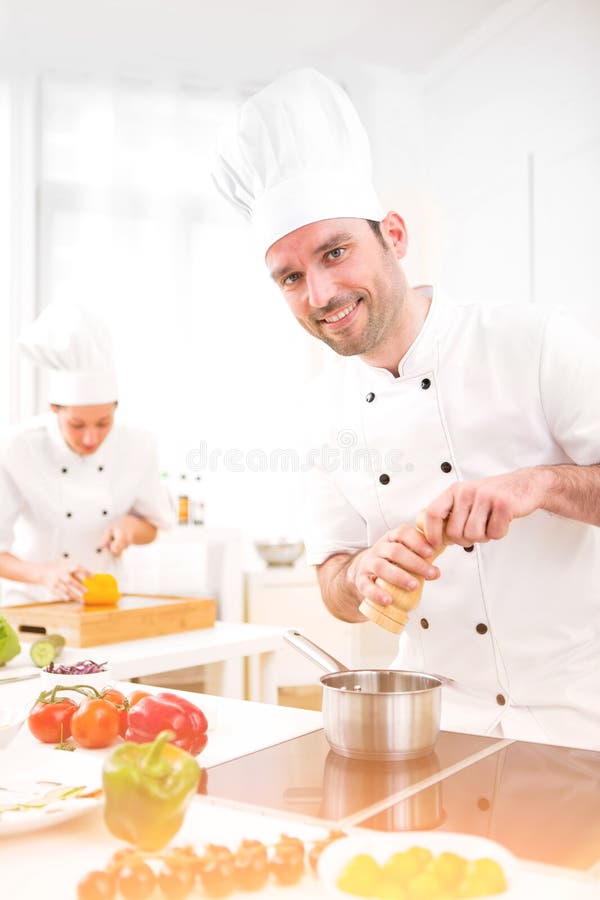 Young Attractive Professional Chef Cooking in His Kitchen Stock Image ...