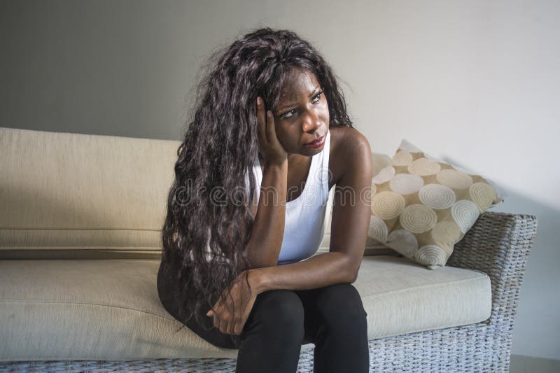 Young Attractive And Sad Black African American Woman Sitting Depressed