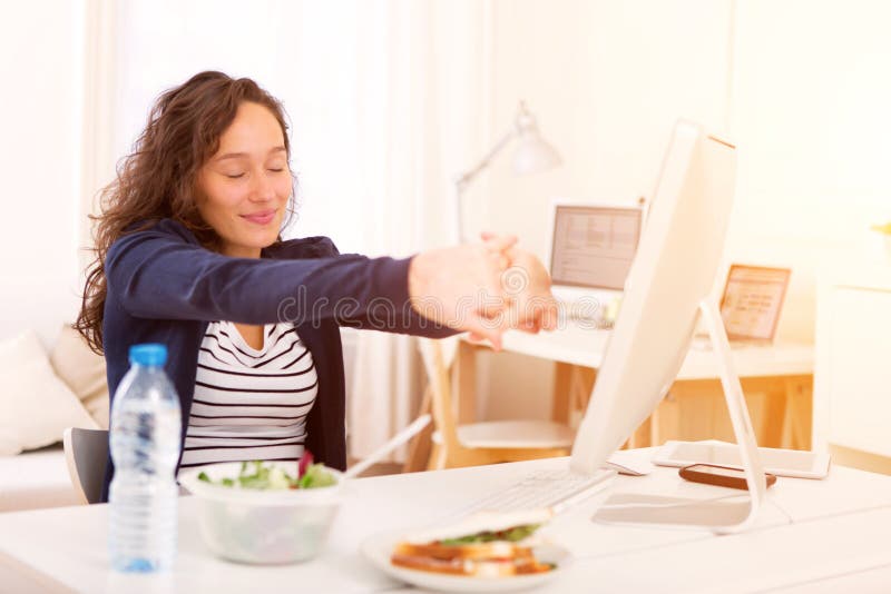 Young Attractive Student Eating while Working Stock Image - Image of ...