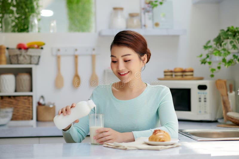 Young Attractive Woman with Milk and Healthy Breakfast in Kitchen Stock ...