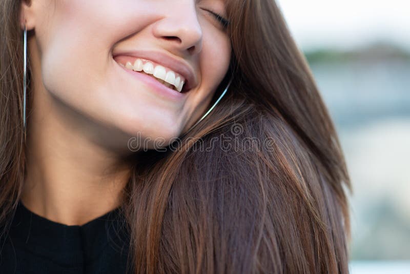Young Attractive Woman With Perfect Smile Winks At Camera Summer
