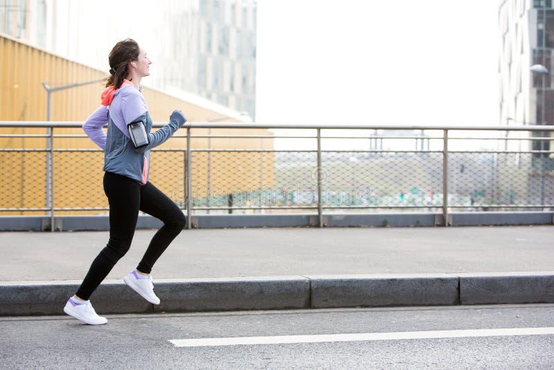 Young Attractive Woman Running Downtown Stock Image - Image of running ...