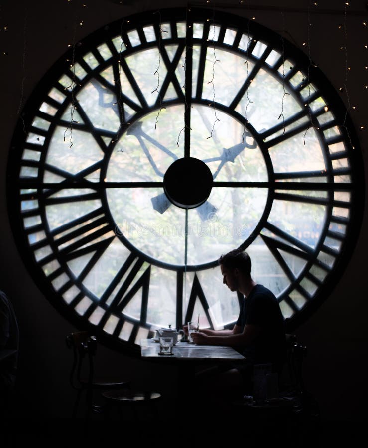 Young Australian Man Sitting on the Table and Drinking Juice Near the ...