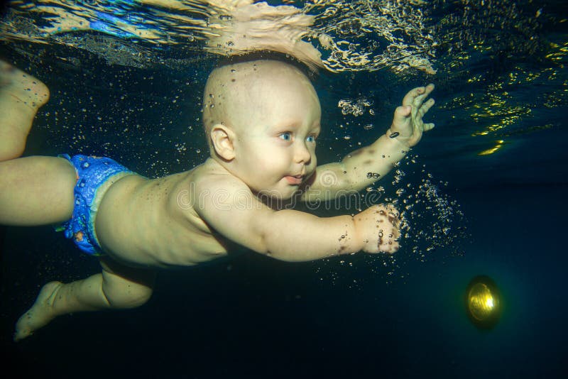 Young Baby Diving in the Swimming Pool Stock Image - Image of action ...
