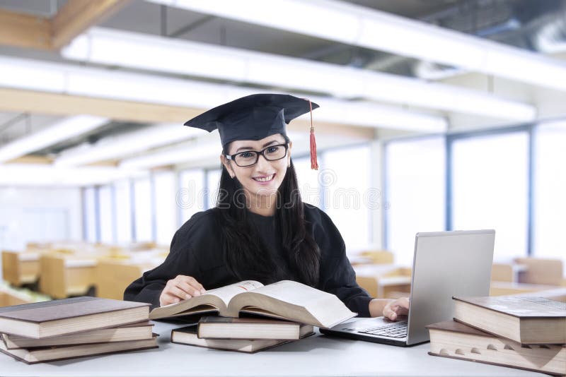 Young Bachelor Studying in Library Stock Photo - Image of graduate ...