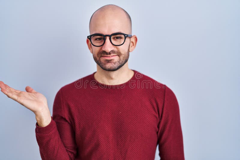 Young Bald Man With Beard Standing Over White Background Wearing