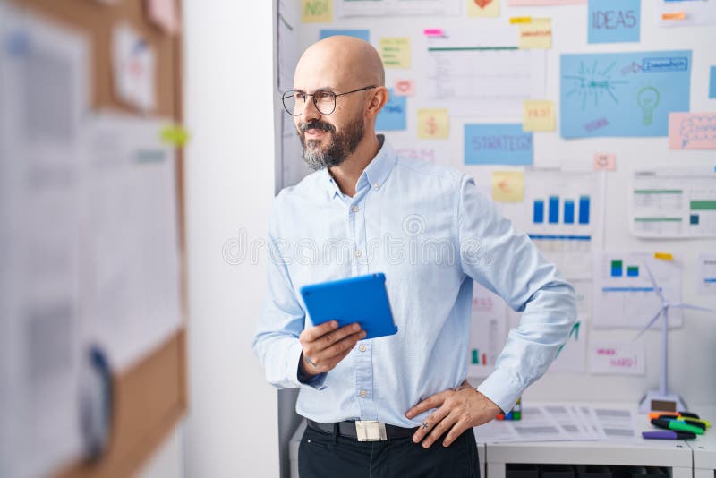 Young Bald Man Business Worker Smiling Confident Using Touchpad at ...