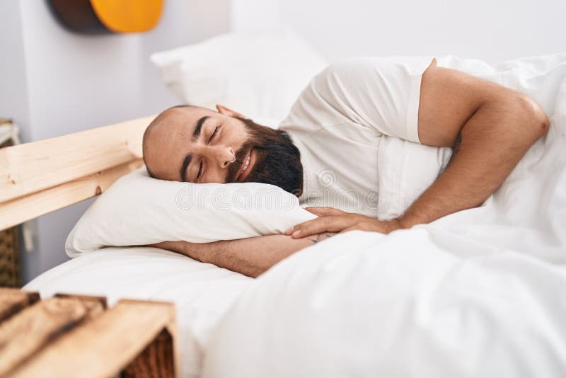 Young Bald Man Lying on Bed Sleeping at Bedroom Stock Photo - Image of ...