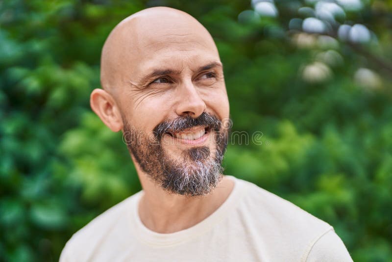 Young Bald Man Smiling Confident Looking To the Side at Park Stock ...