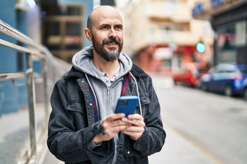 Young Bald Man Smiling Confident Using Smartphone at Street Stock Image ...